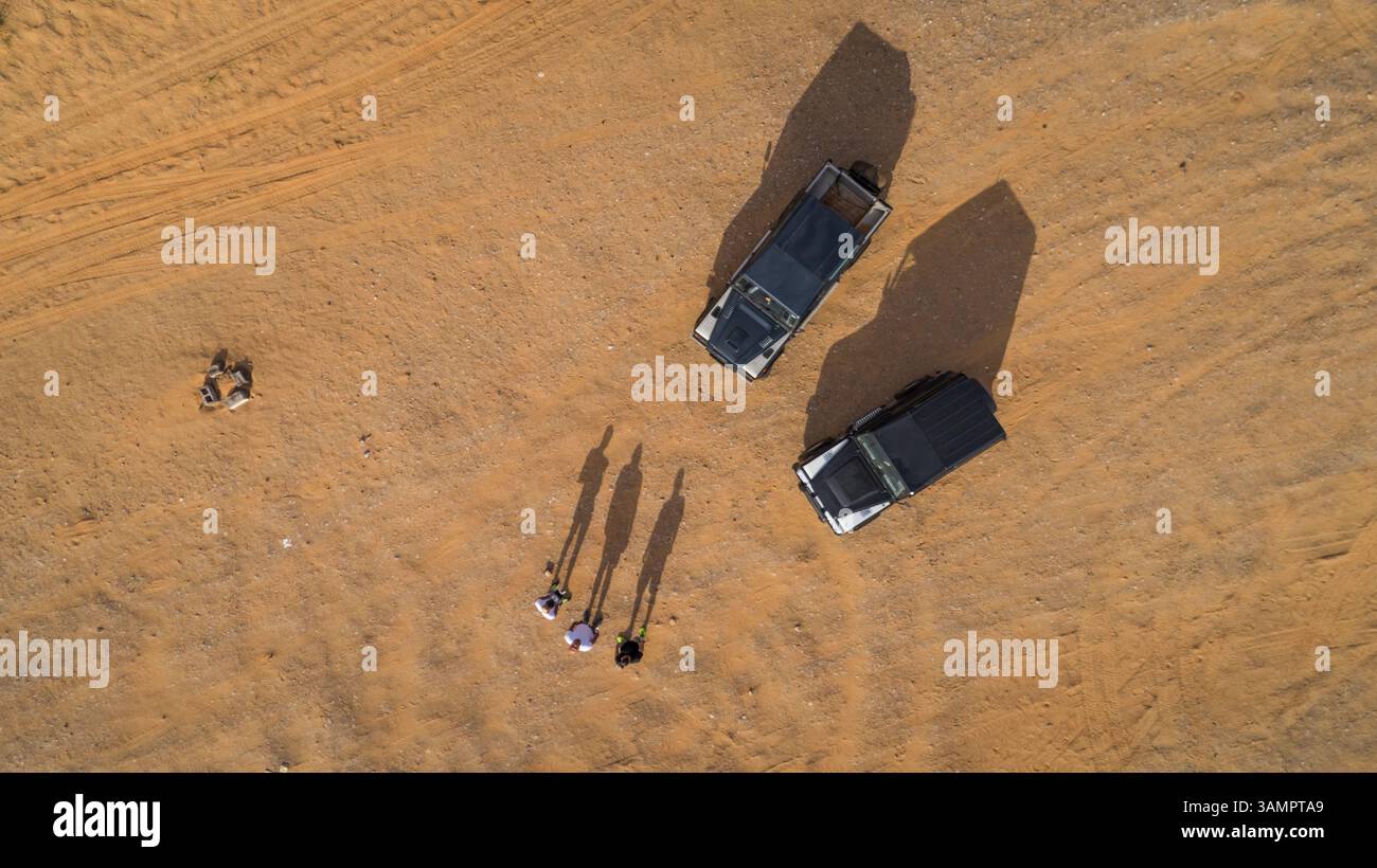 Aerial selfie of friends with their safari cars in the Camel Rock ...