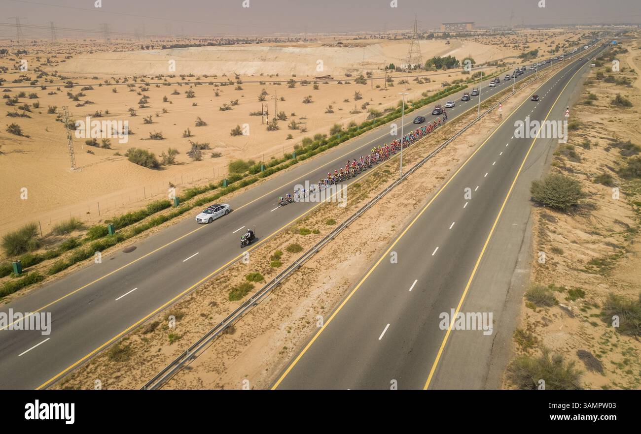 Aerial view of a cycling competition on a road in the middle of the ...