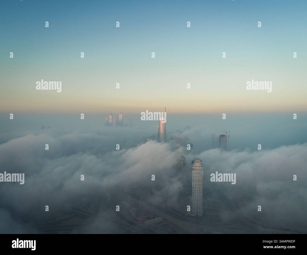Aerial view of skyscrapers and Almas tower in the clouds of Dubai, U.A ...