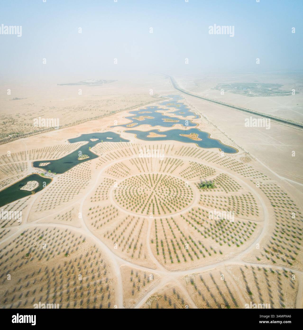 Aerial view of Al Qudra lakes in the middle of Saih Al Salam Desert in ...