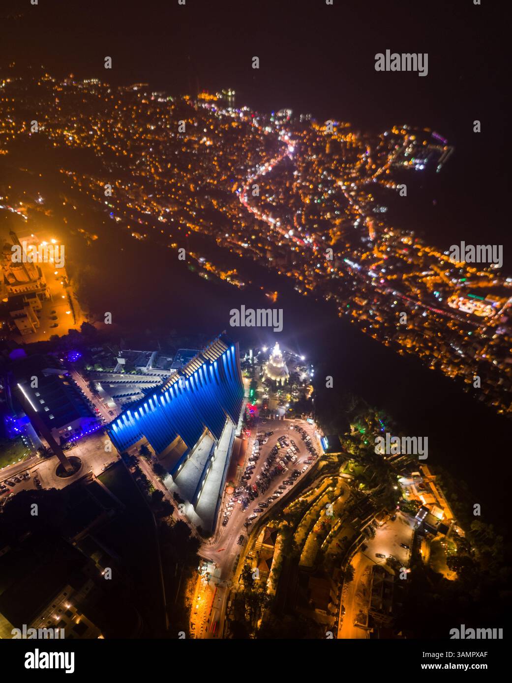 Aerial view of our Lady of Lebanon Basilica and statue illuminated at ...