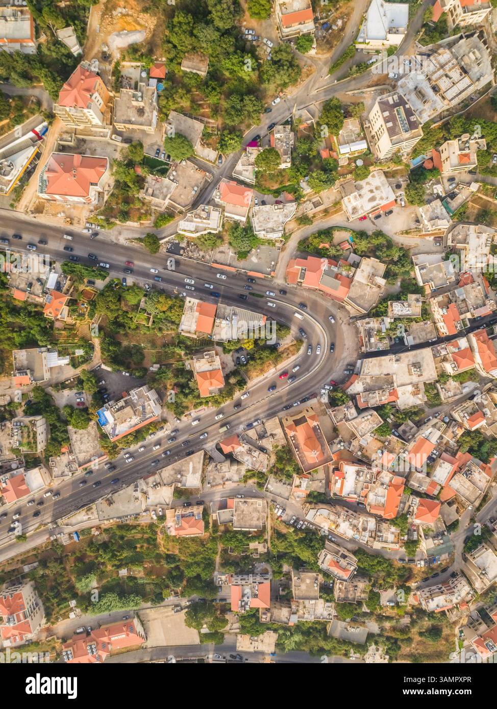 Aerial view of a curved road in the picturesque village of Aley in ...