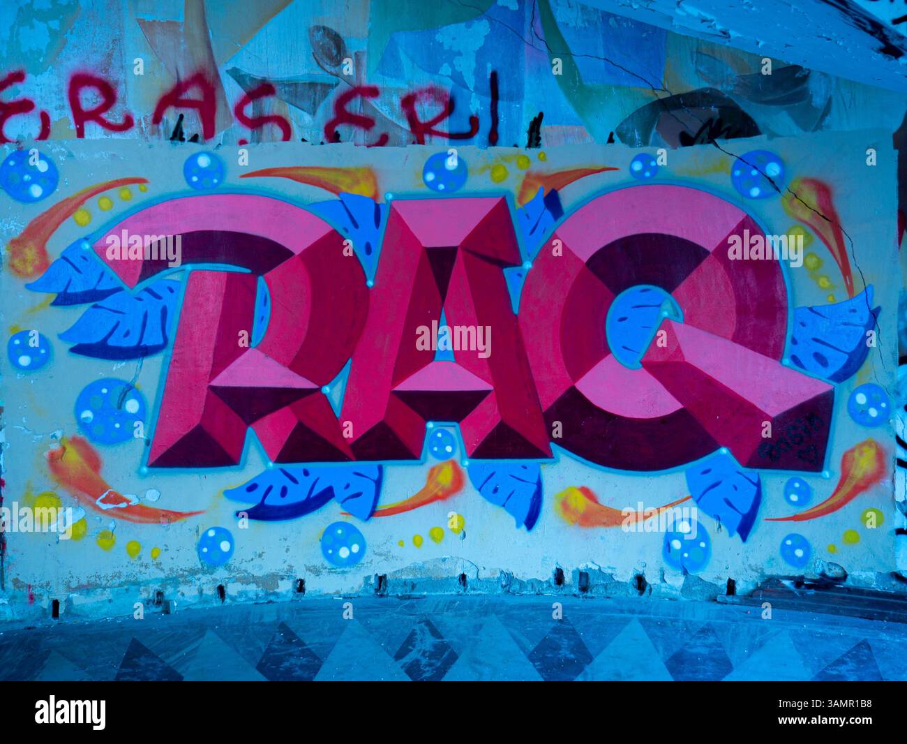 A colorful and striking graffiti mural showcasing bold, three ...