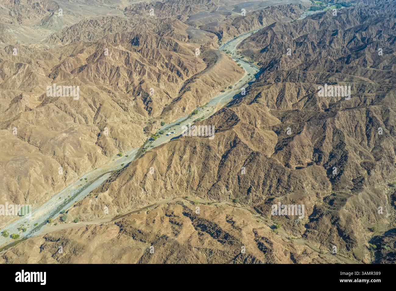 Aerial view of Wadi Shawqa, a canyon among the rocky hills in Ras al ...