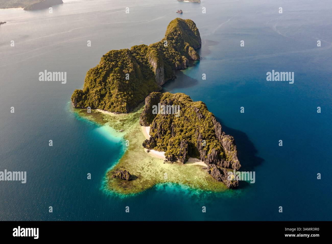 Aerial view of karst island and remote beach in archipelago of El Nido ...