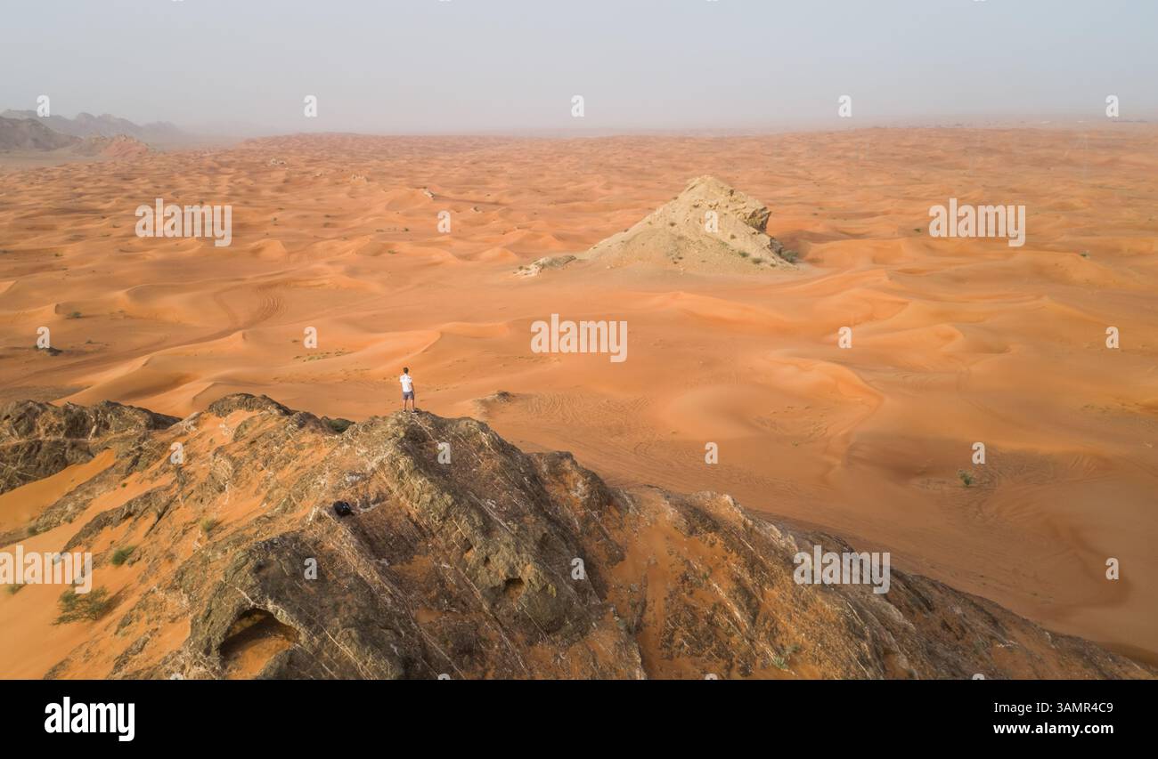Aerial view of a man on the top of a rocky mountain in the Camel Rock ...