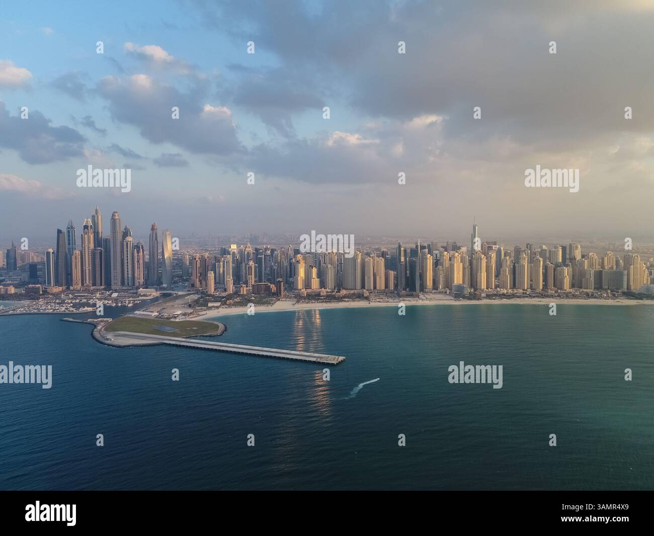 Aerial panoramic view of skyscrapers and bay of Dubai, United Arab ...