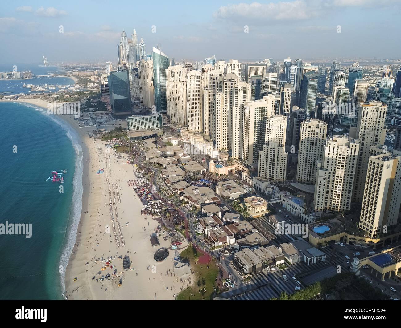 Aerial panoramic view of skyscrapers and bay of Dubai, United Arab ...