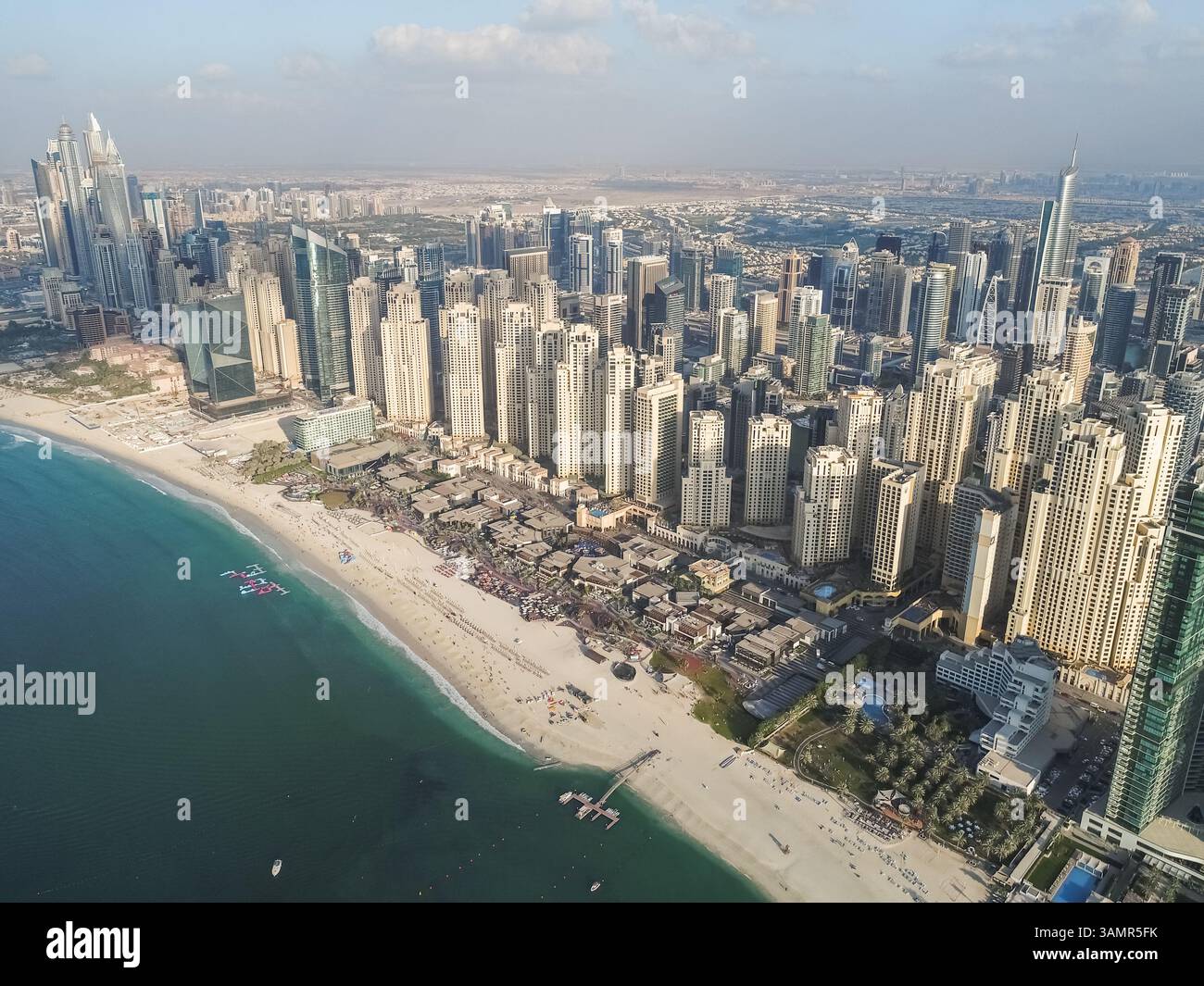 Aerial panoramic view of skyscrapers and bay of Dubai, United Arab ...