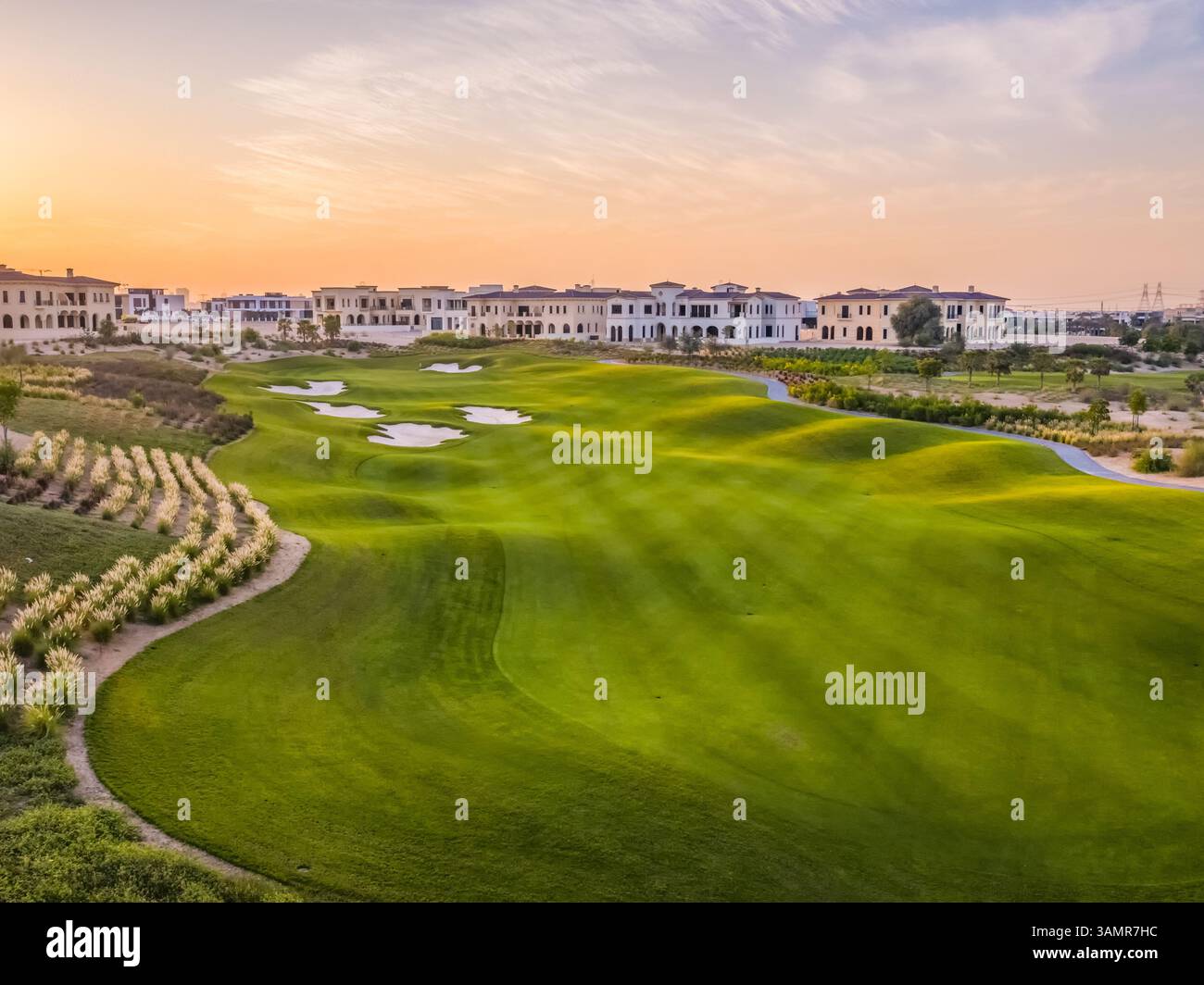 Aerial view of green golf club on a luxury residential area, Dubai, U.A ...