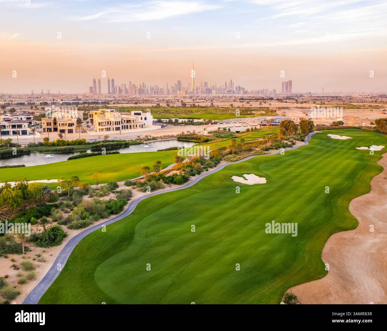 Aerial view of luxury golf club with Dubai at the background, U.A.E ...