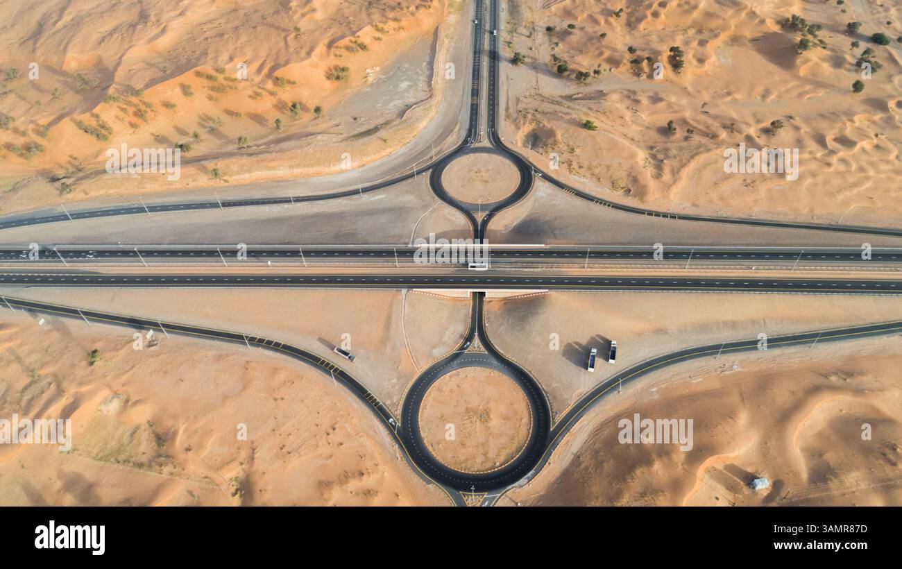 Aerial view of geometrical roundabout and roads in the desert of Umm Al ...