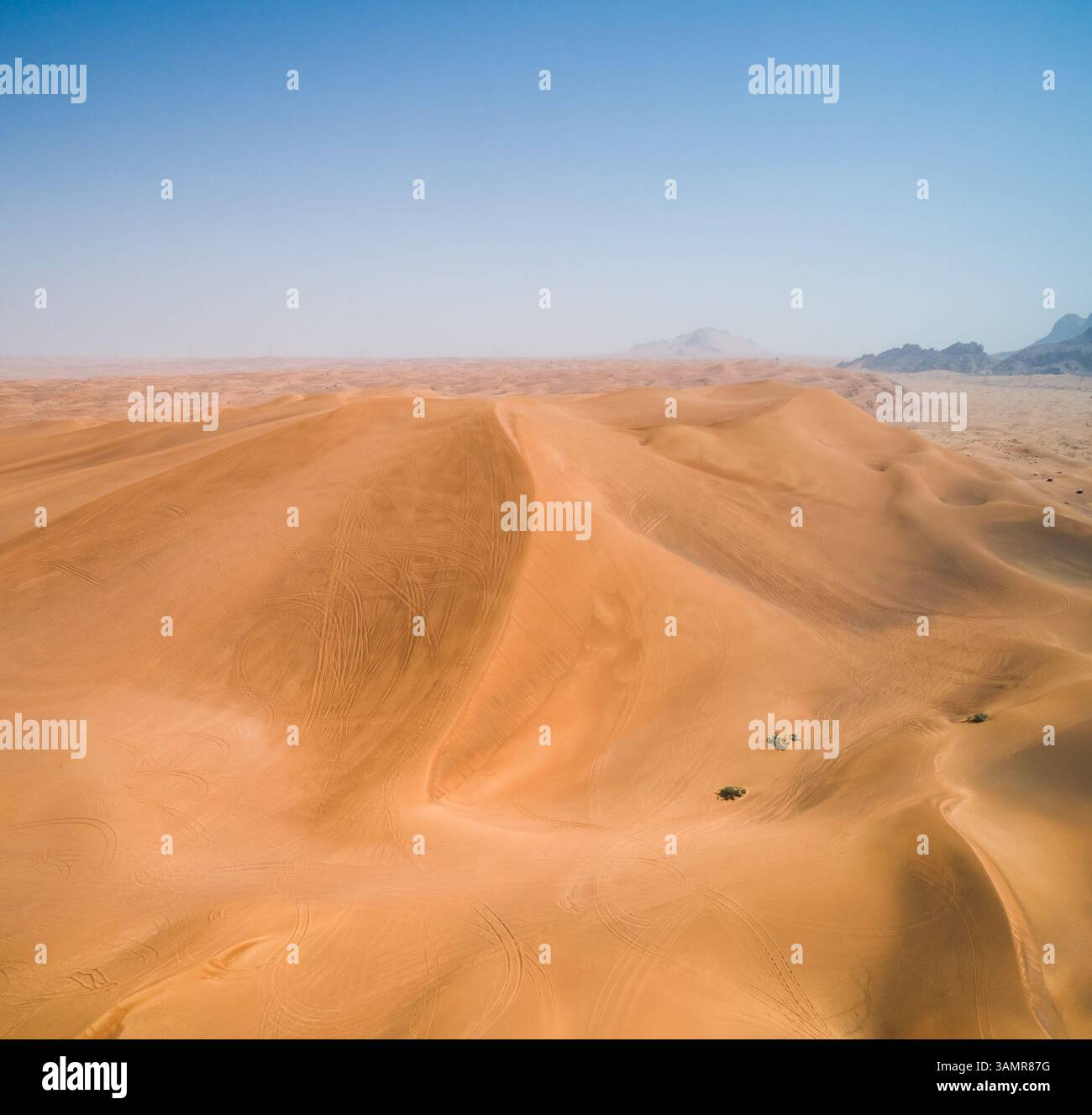 Aerial view of quad bikes track in the dunes of Sharjah desert, U.A.E ...