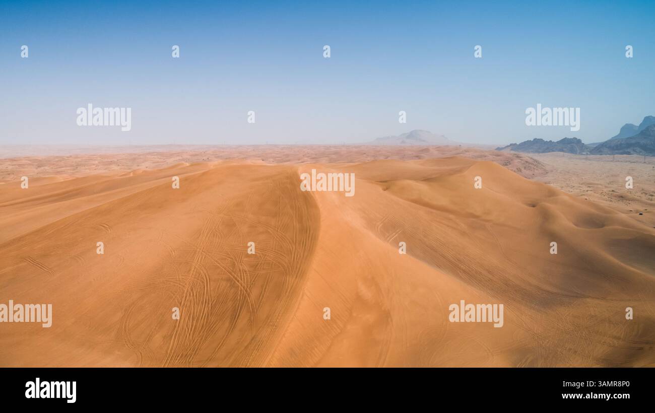 Aerial view of quad bikes track in the dunes of Sharjah desert, U.A.E ...