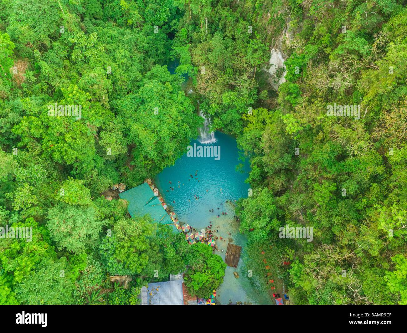 Aerial view of people swimming in pool by Kawasan Falls in Alegria ...