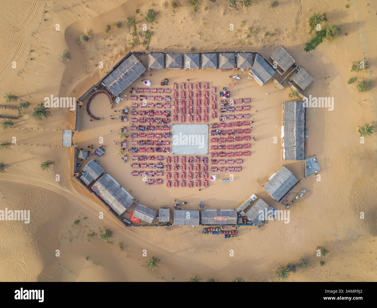 Aerial view of desert safari camp with straw roof huts, Al Awir, Dubai ...