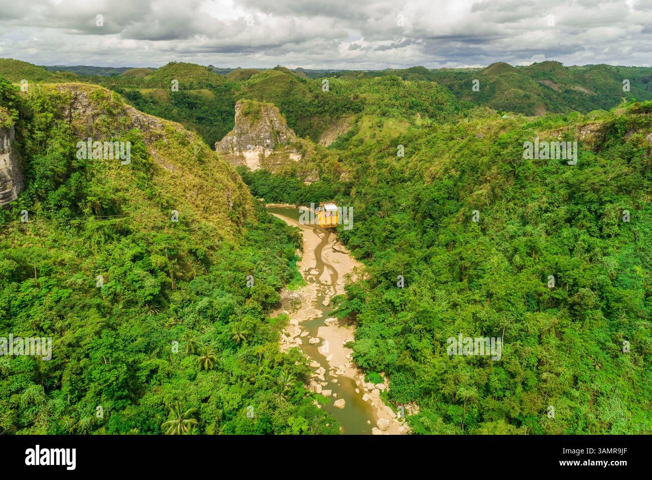 Aerial view of cable car above Inabanga river in Danao, Philippines ...