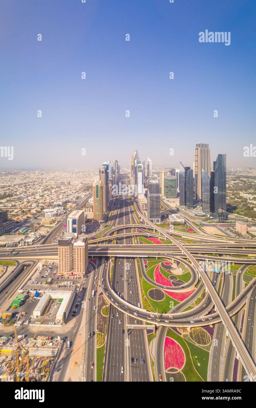 Aerial panoramic view of skyscrapers and roads by Burj Khalifa, Dubai ...