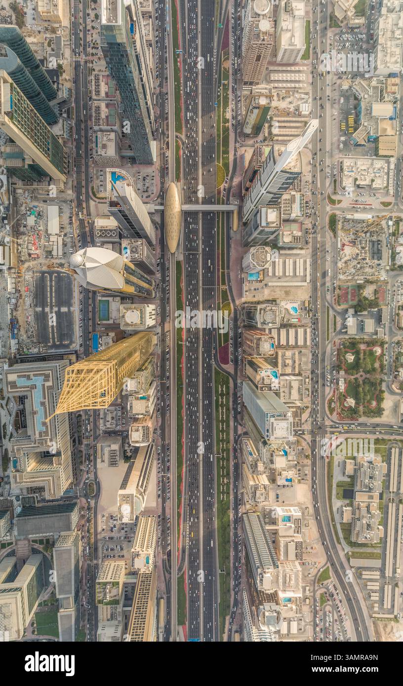 Aerial view of Dubai colourful skyscrapers, and long busy road ,UAE ...