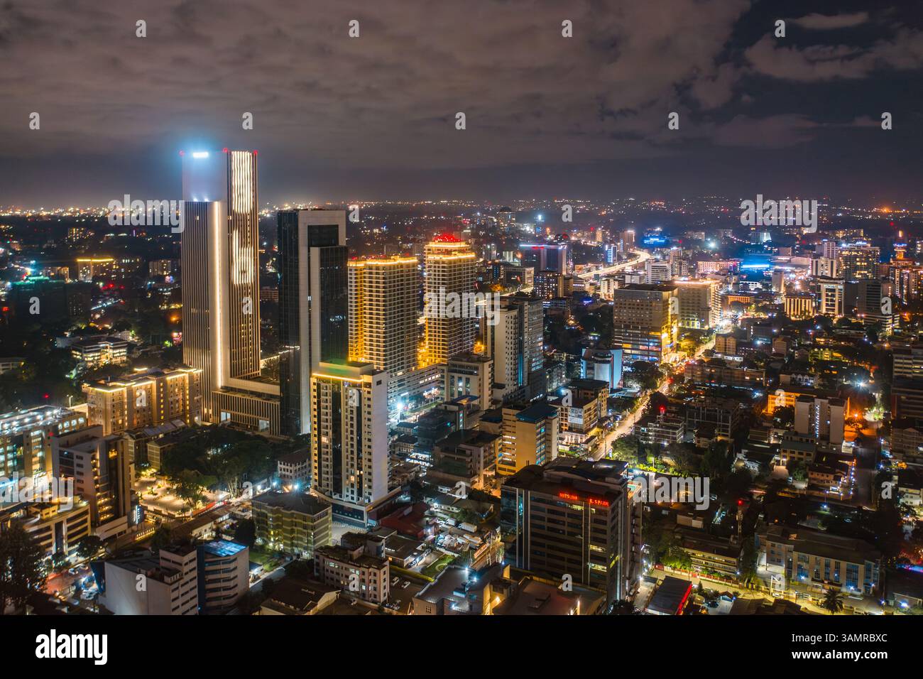 Aerial view of vibrant cityscape illuminated at night with modern ...