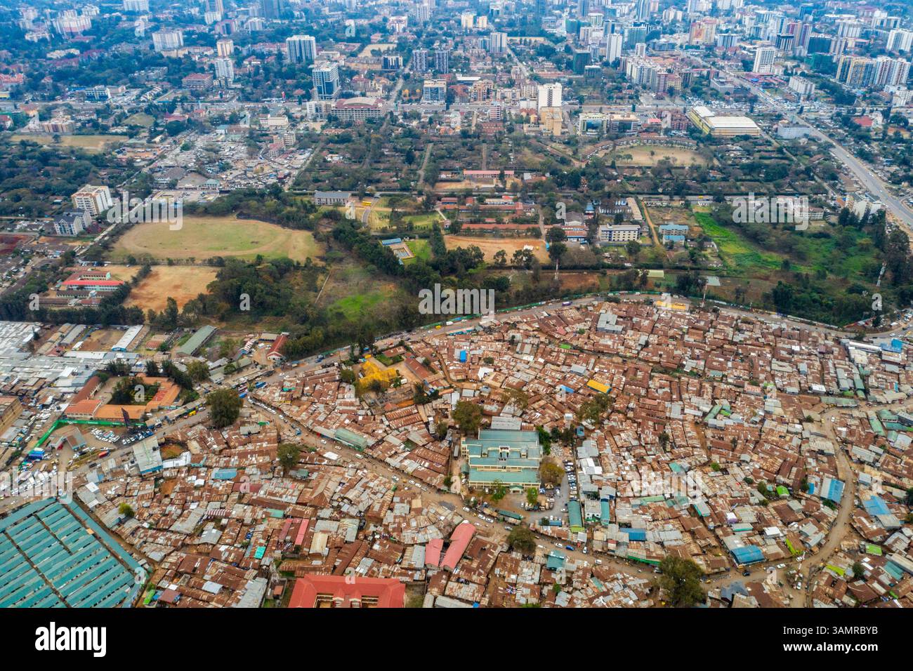 Aerial view of vibrant and bustling Kibera slum with dense rooftops and ...
