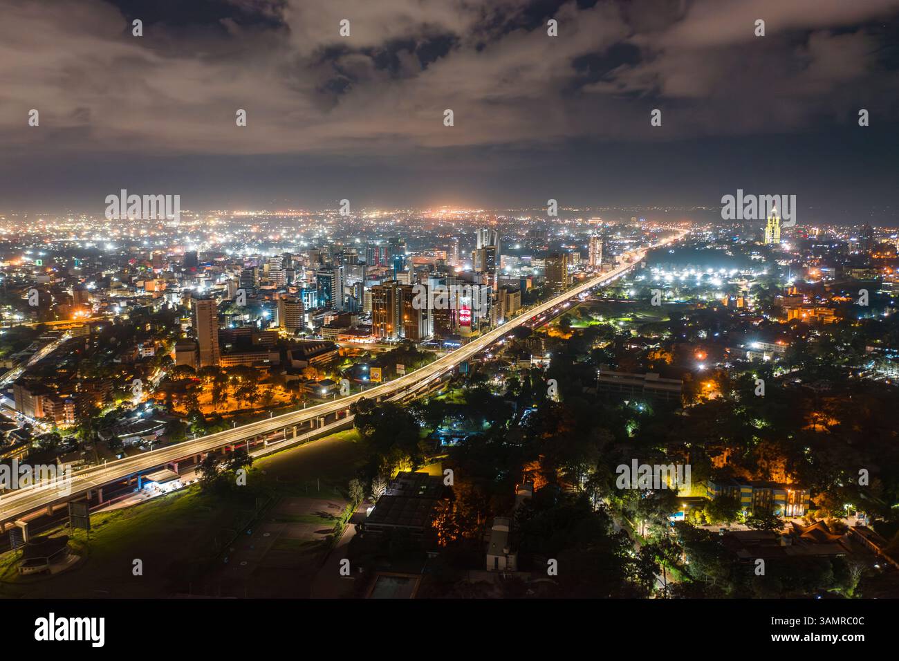 Aerial view of vibrant cityscape with illuminated Nairobi Expressway ...