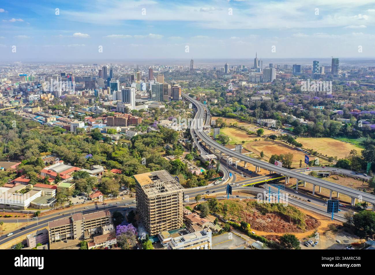 Aerial view of bustling city skyline with modern skyscrapers and Nairobi Expressway, Parklands ...