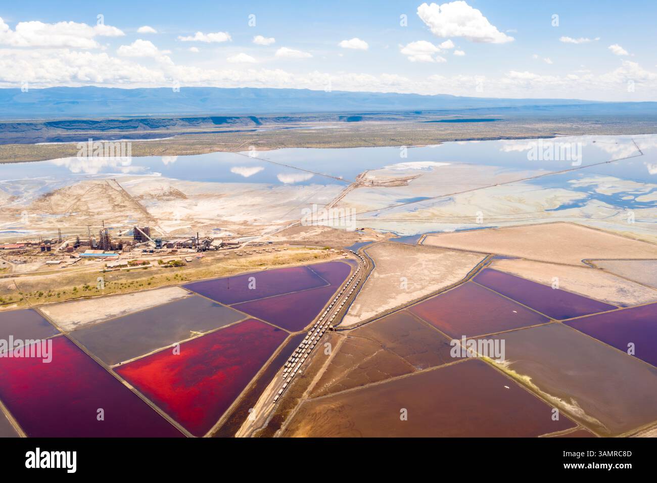 Aerial view of colorful salt flats and soda ash ponds with mining ...
