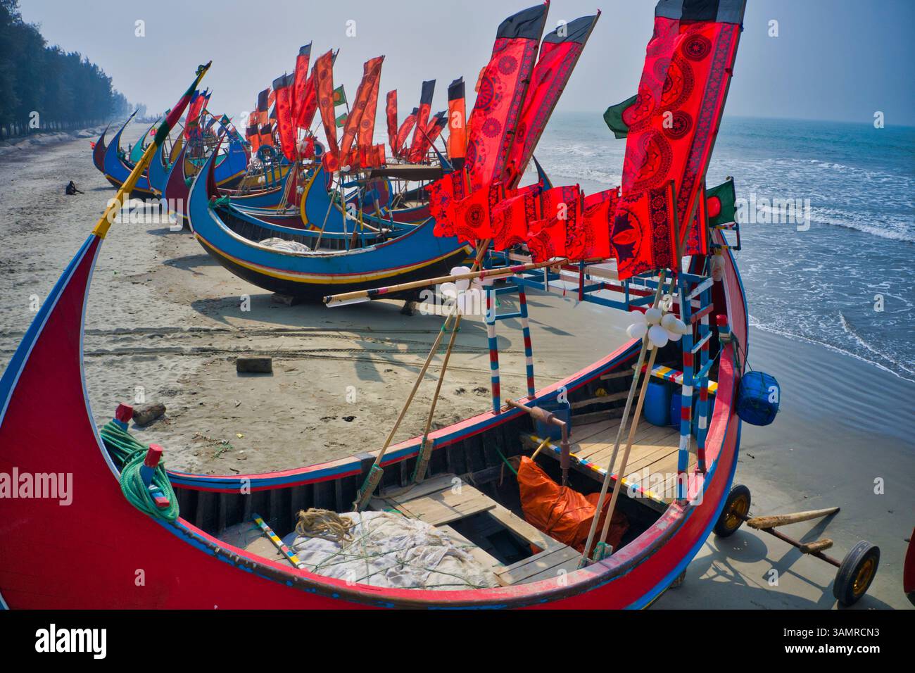 Aerial view of traditional fishing boats along the shoreline on the beach on St. Martin's Island ...