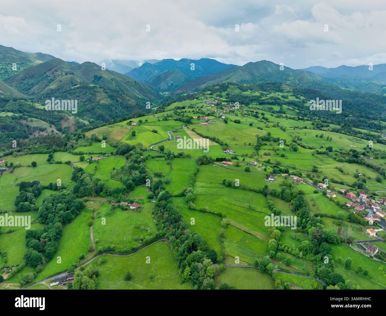 Aerial view of lush green valley with rolling hills and picturesque ...