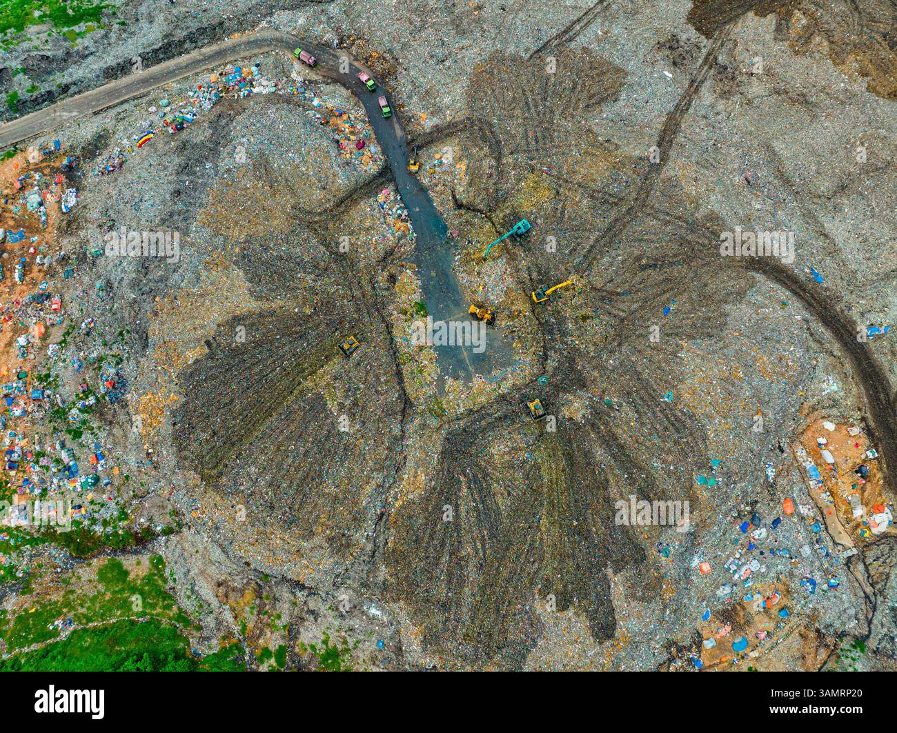 Aerial view of cranes working at the largest waste dumping yard in ...