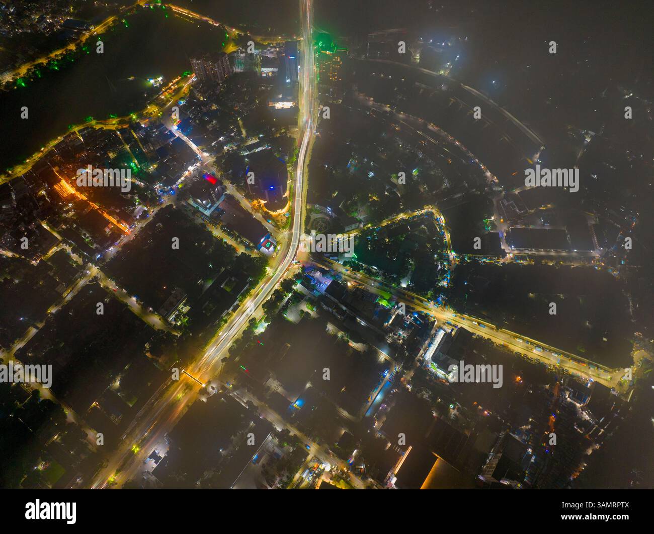 Aerial view of Dhaka City at night with low clouds with residential ...