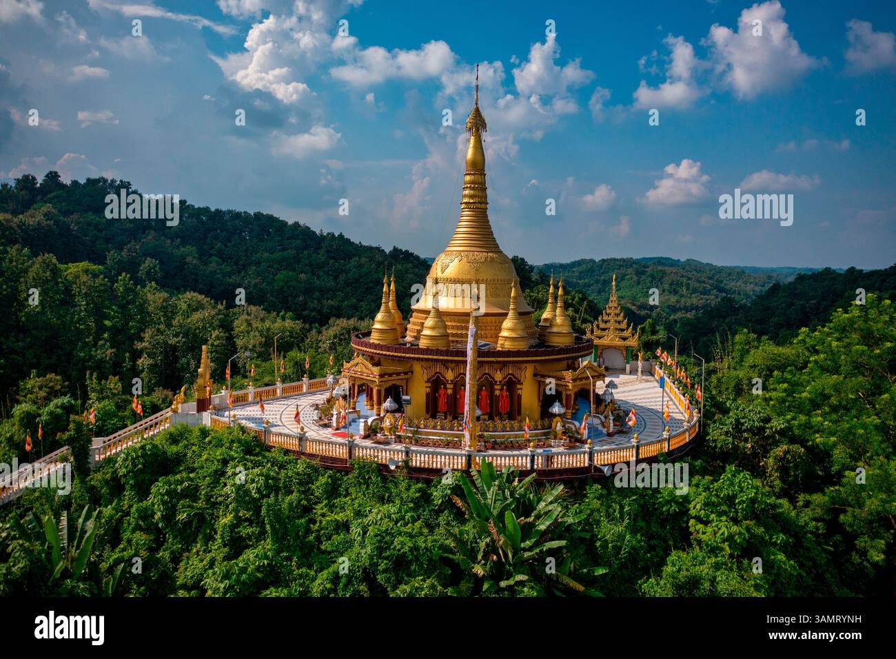 Aerial view of Bandarban temple with golden dome and big statue ...