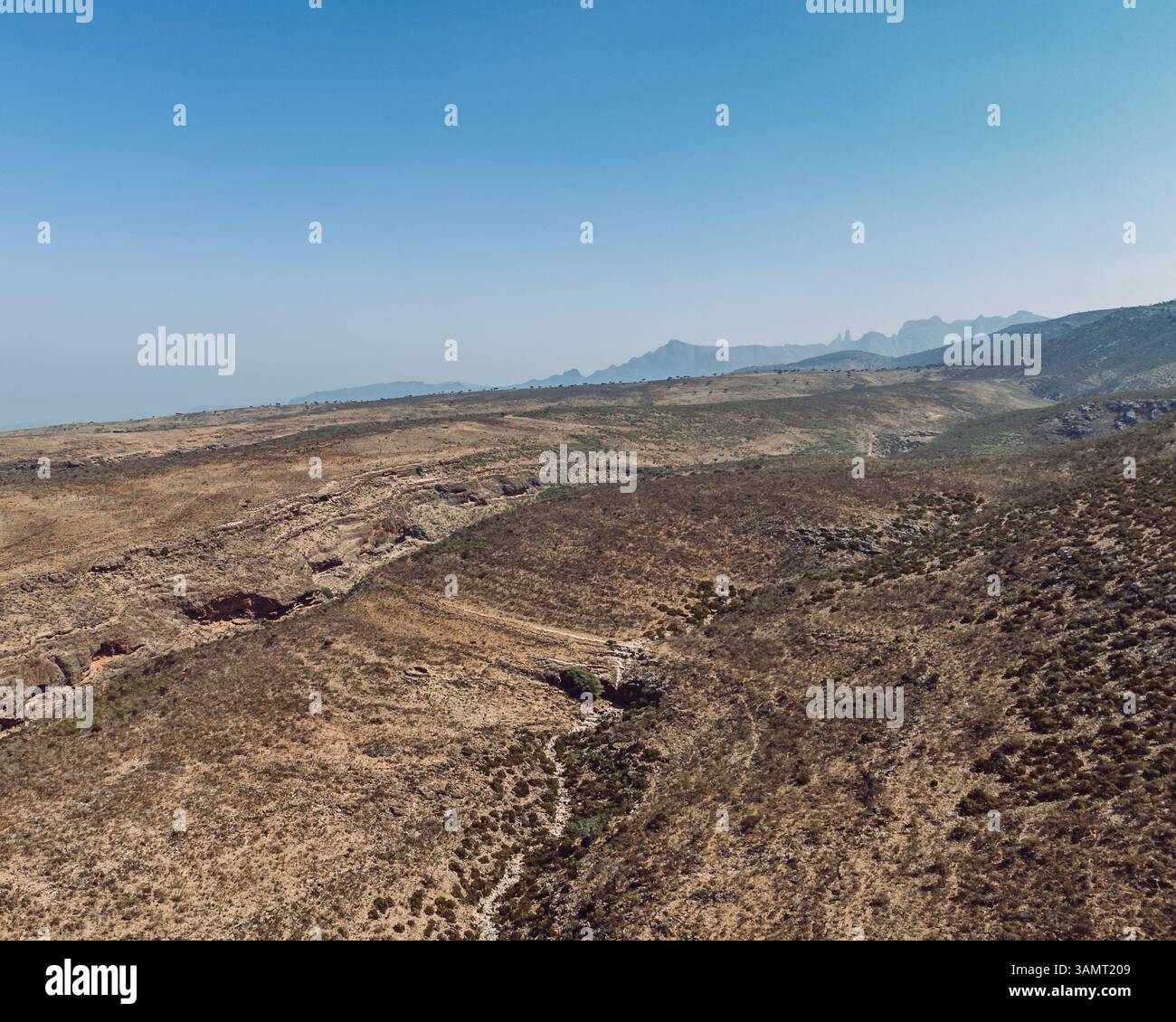 Expansive aerial view of Diksam Plateau’s rugged terrain in Socotra ...