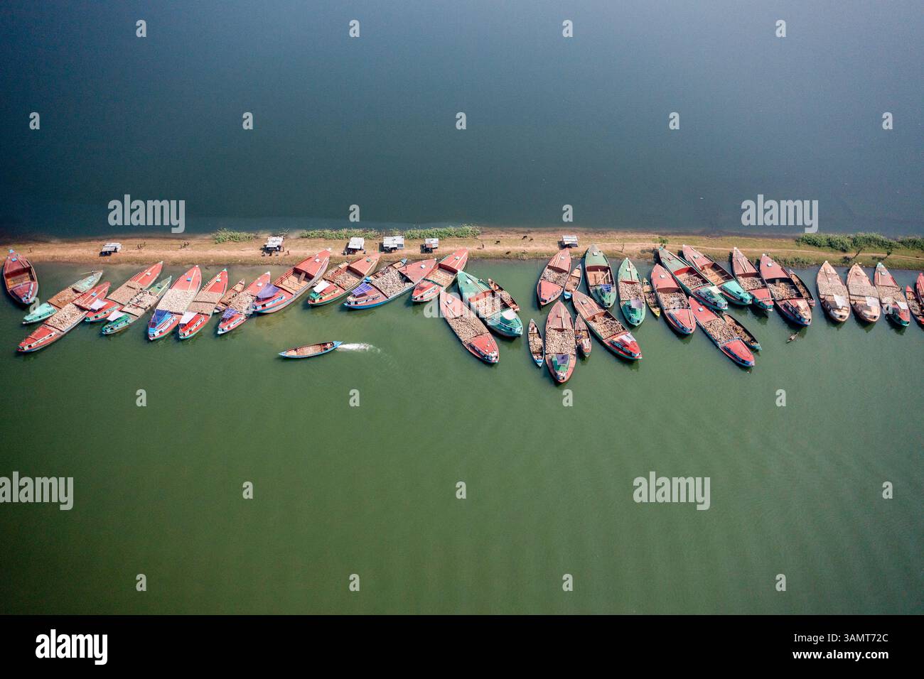 Aerial view of canoe used for transporting stones along the shoreline on the beach on St. Martin ...