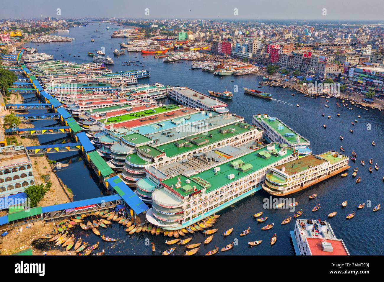 Dhaka, Bangladesh - 13 April 2019: Aerial view of a line of ships docked along Buriganga river ...