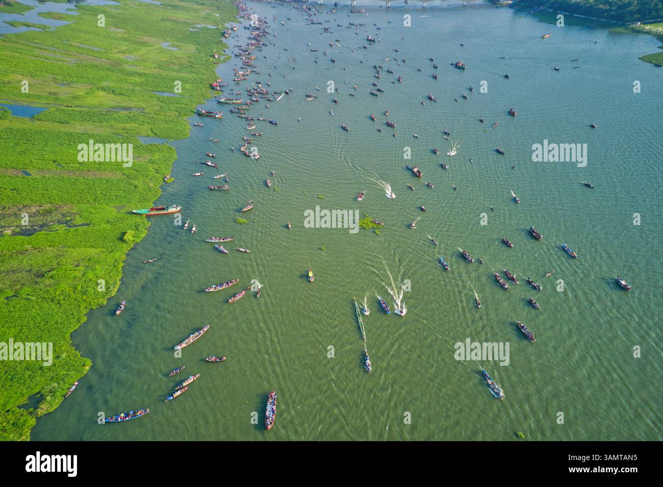 Aerial view of several traditional boats floating in Meghna river ...