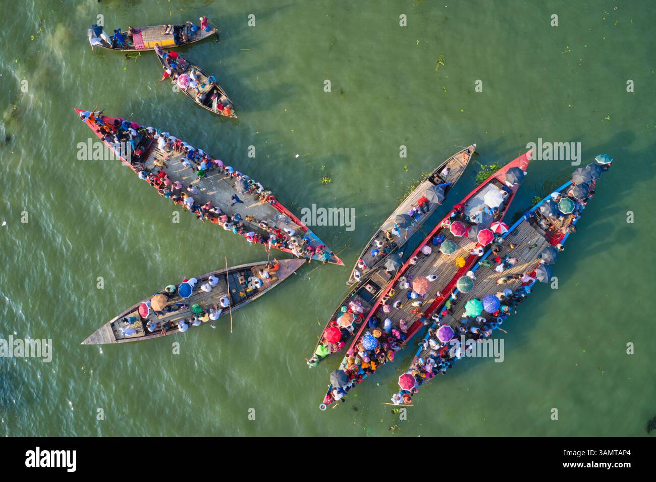 Aerial view of several traditional boats floating in Meghna river ...