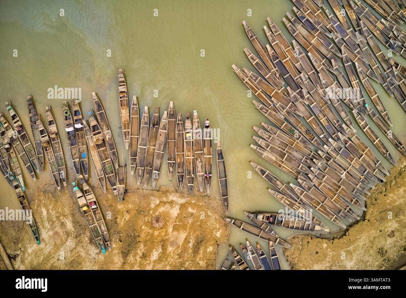 Aerial view of many canoes used for fishing docked along Rakti river in ...