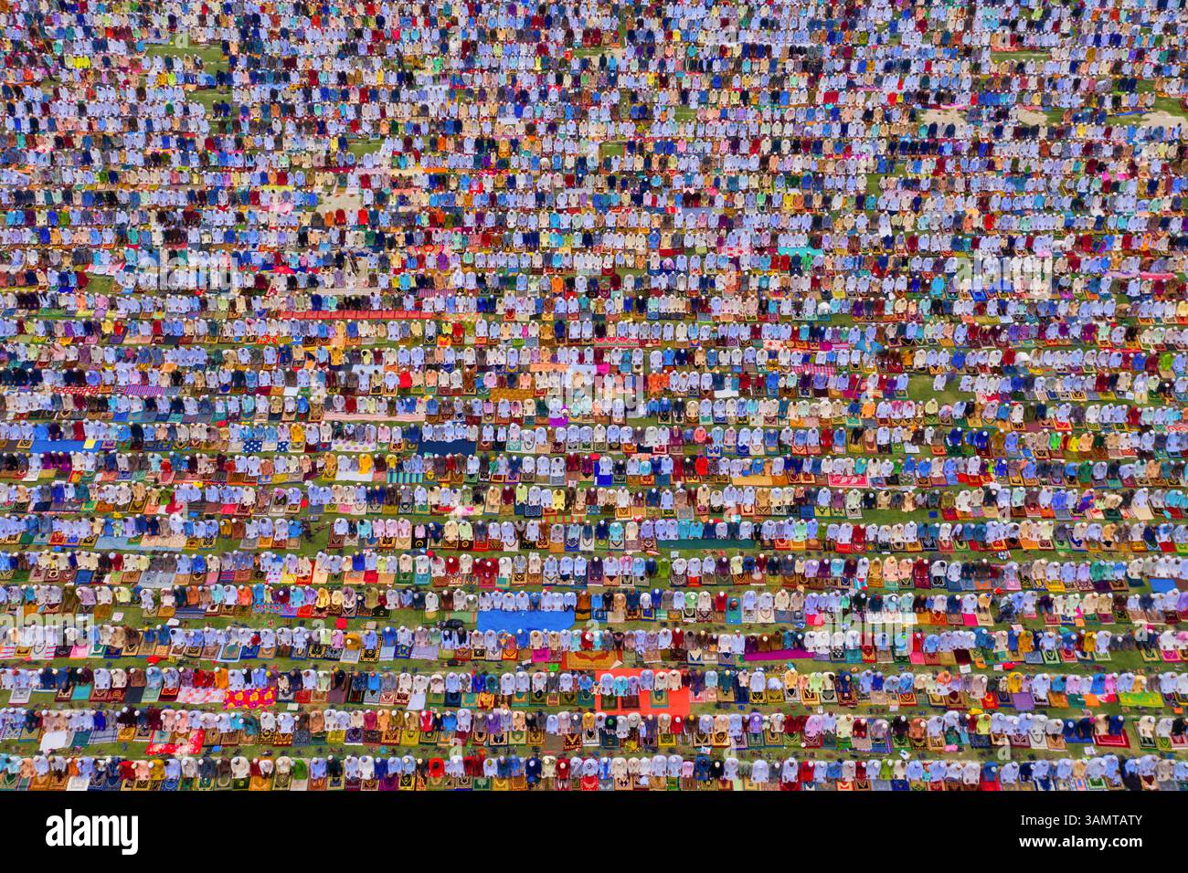 Aerial view of a vast crowd of people worshipping at Gore Shahid park ...