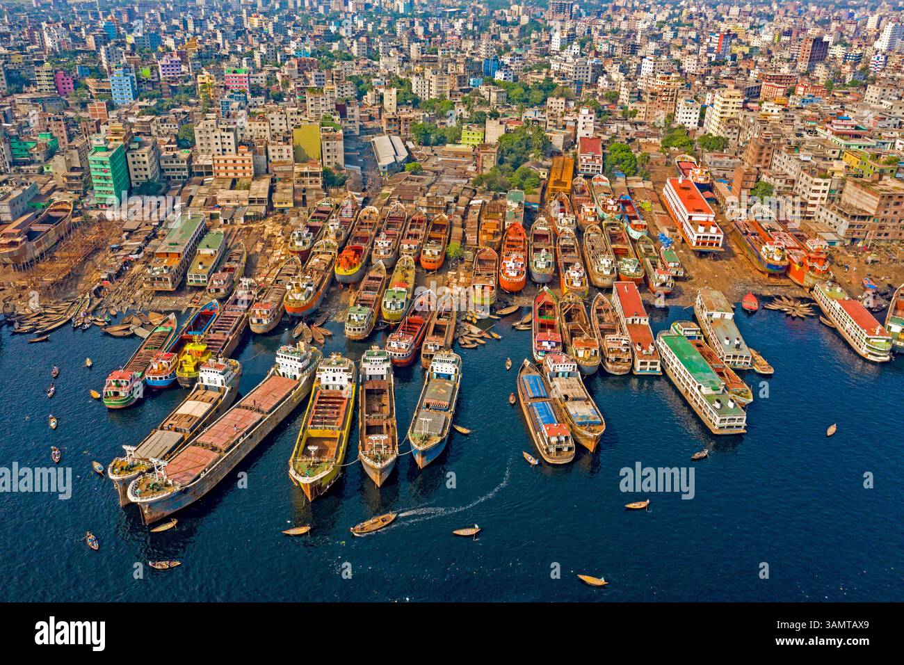 Aerial view of several boats under construction docked along Buriganga river in Keraniganj with ...