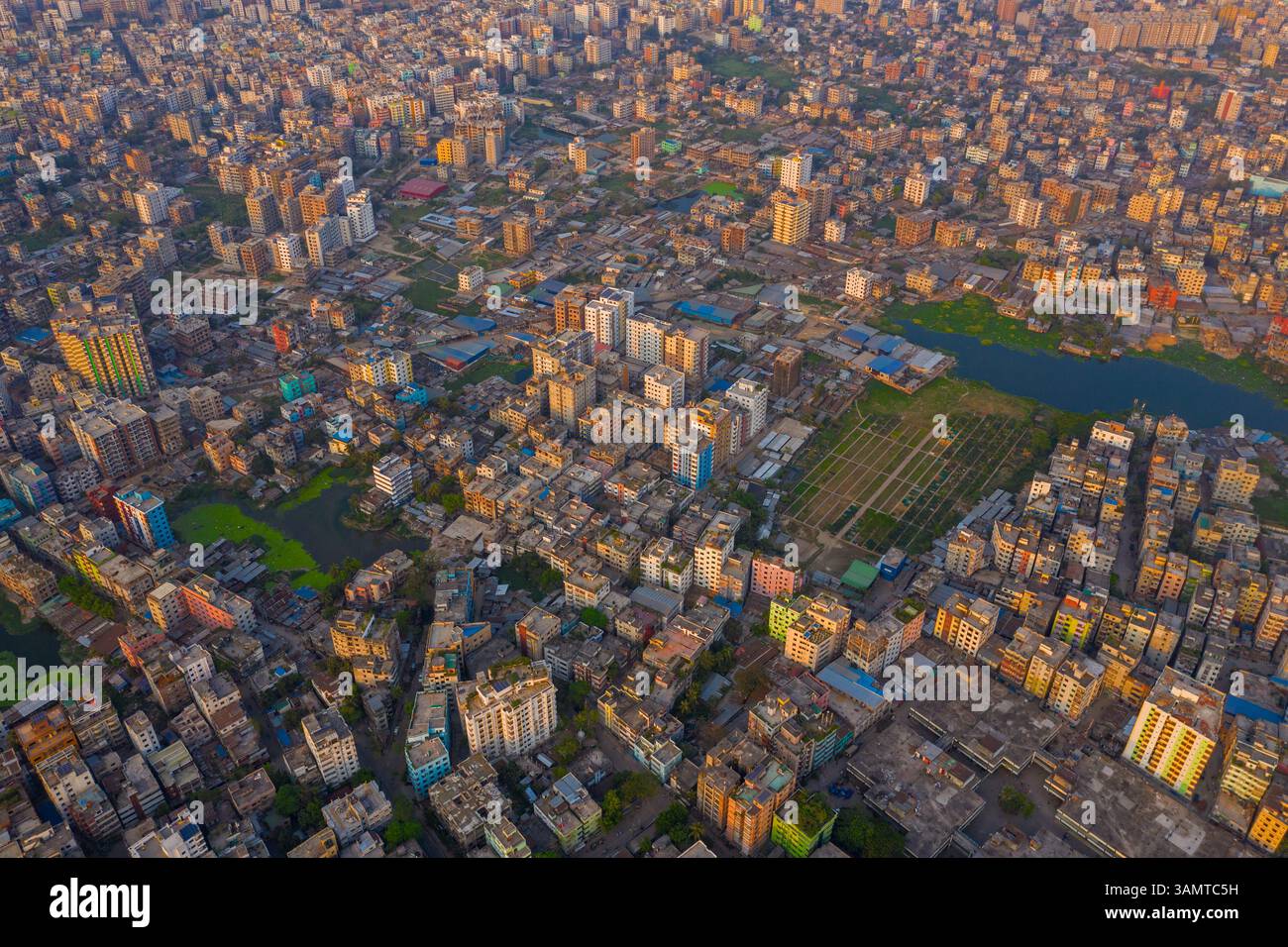 Aerial view of Dhaka City centre with residential district at sunset ...