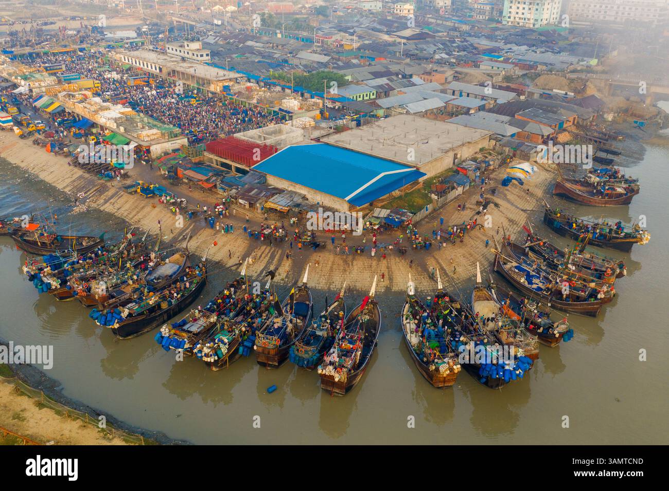 Aerial view of a line of fishing boat docket at Rahman fish market along the Karnaphuli River in ...