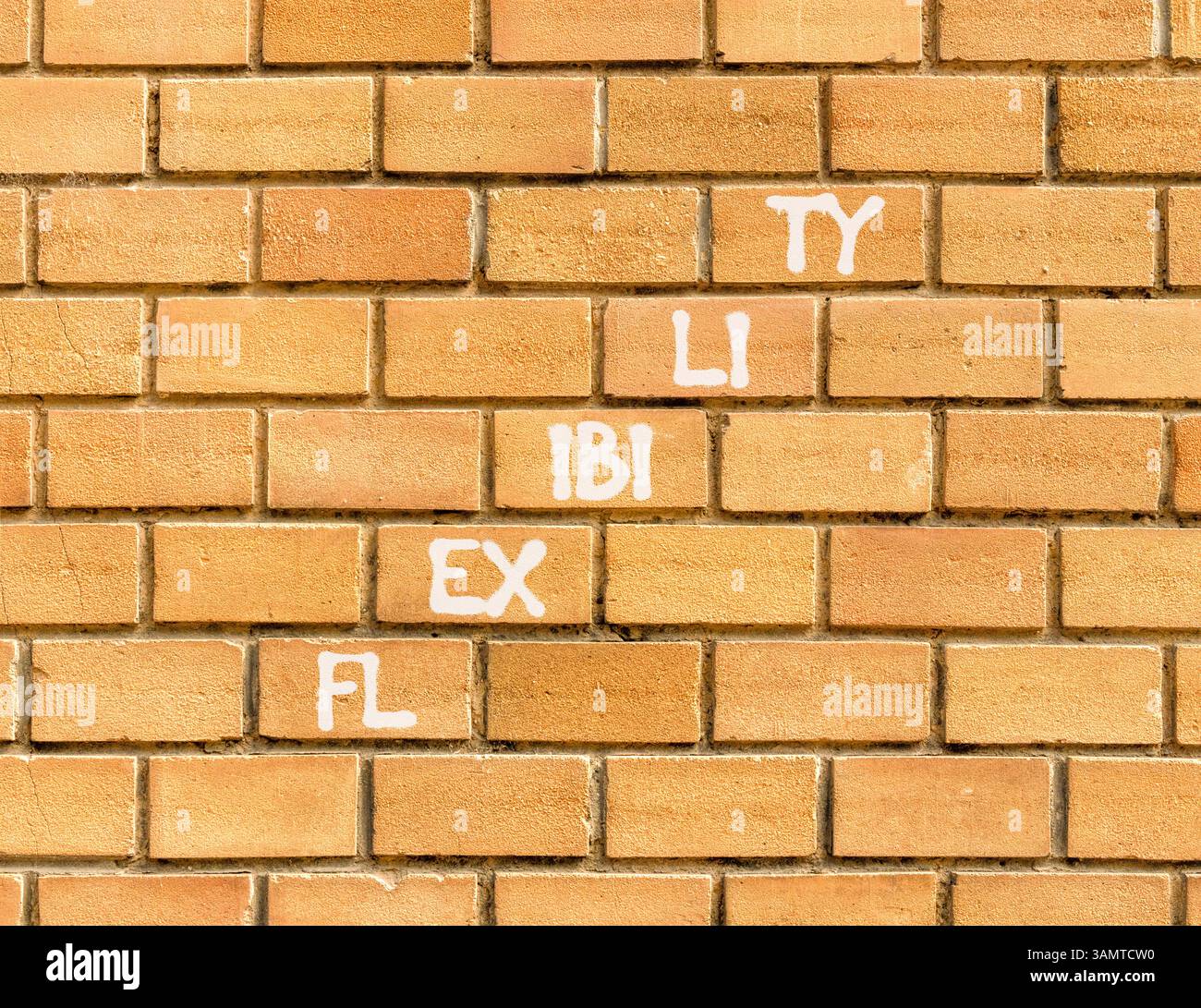 Flexibility symbol. Concept word Flexibility on beautiful brown bricks ...