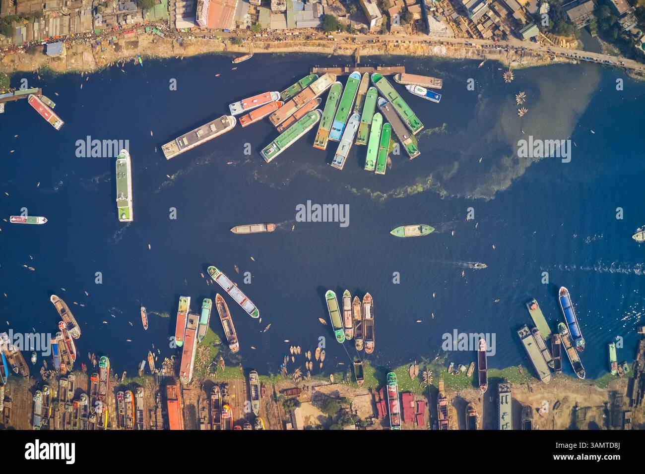 Aerial view of colourful ferry boat docket at small wharf along Buriganga river in Keraniganj ...