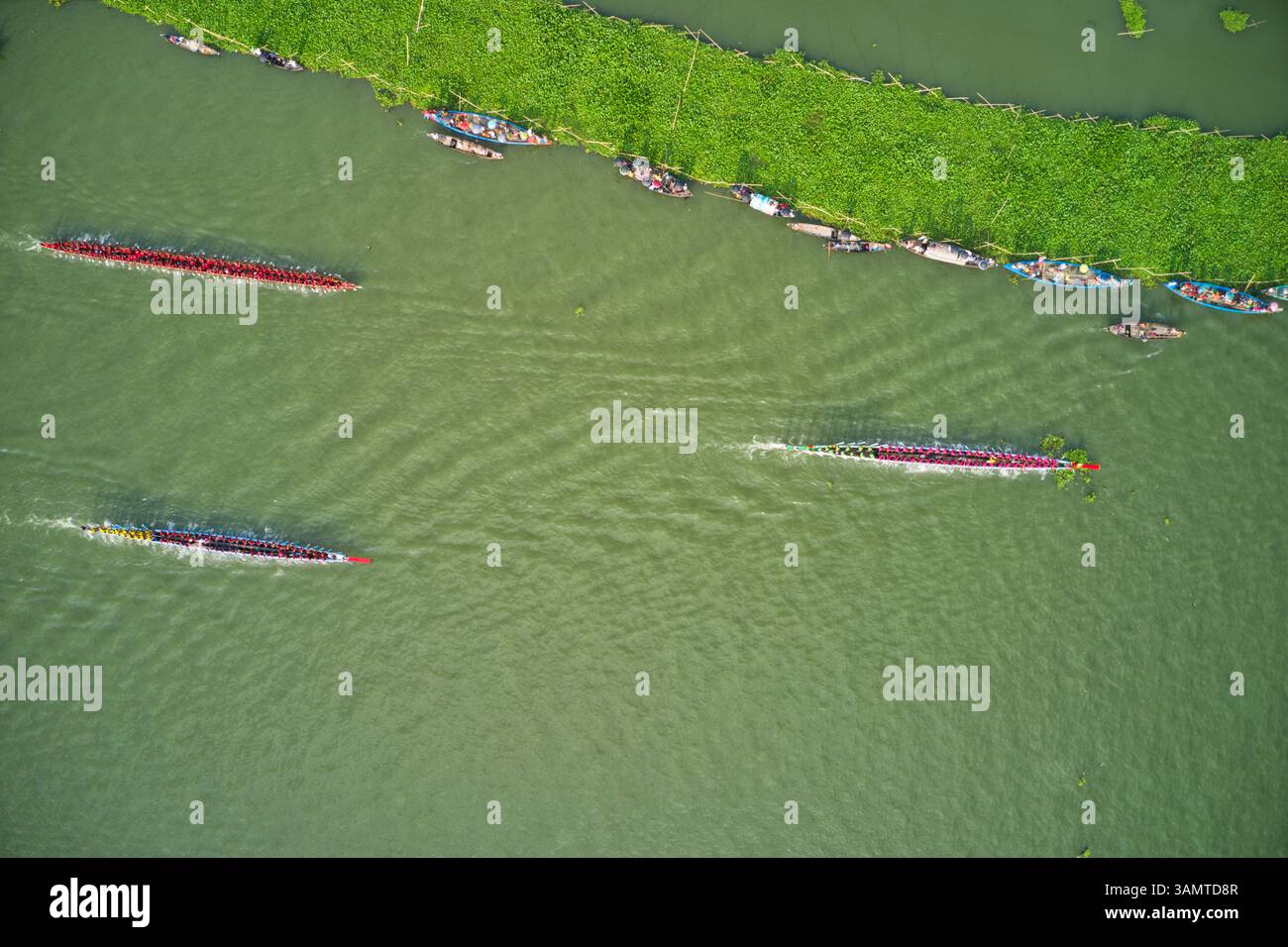 Aerial view of several traditional boats floating in Meghna river branch in Daudkandi ...