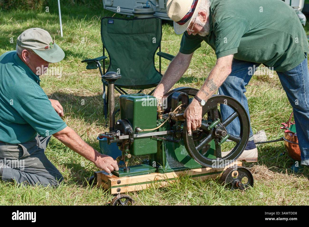Two men operating a static engine at Morval vintage rally 2007 in ...