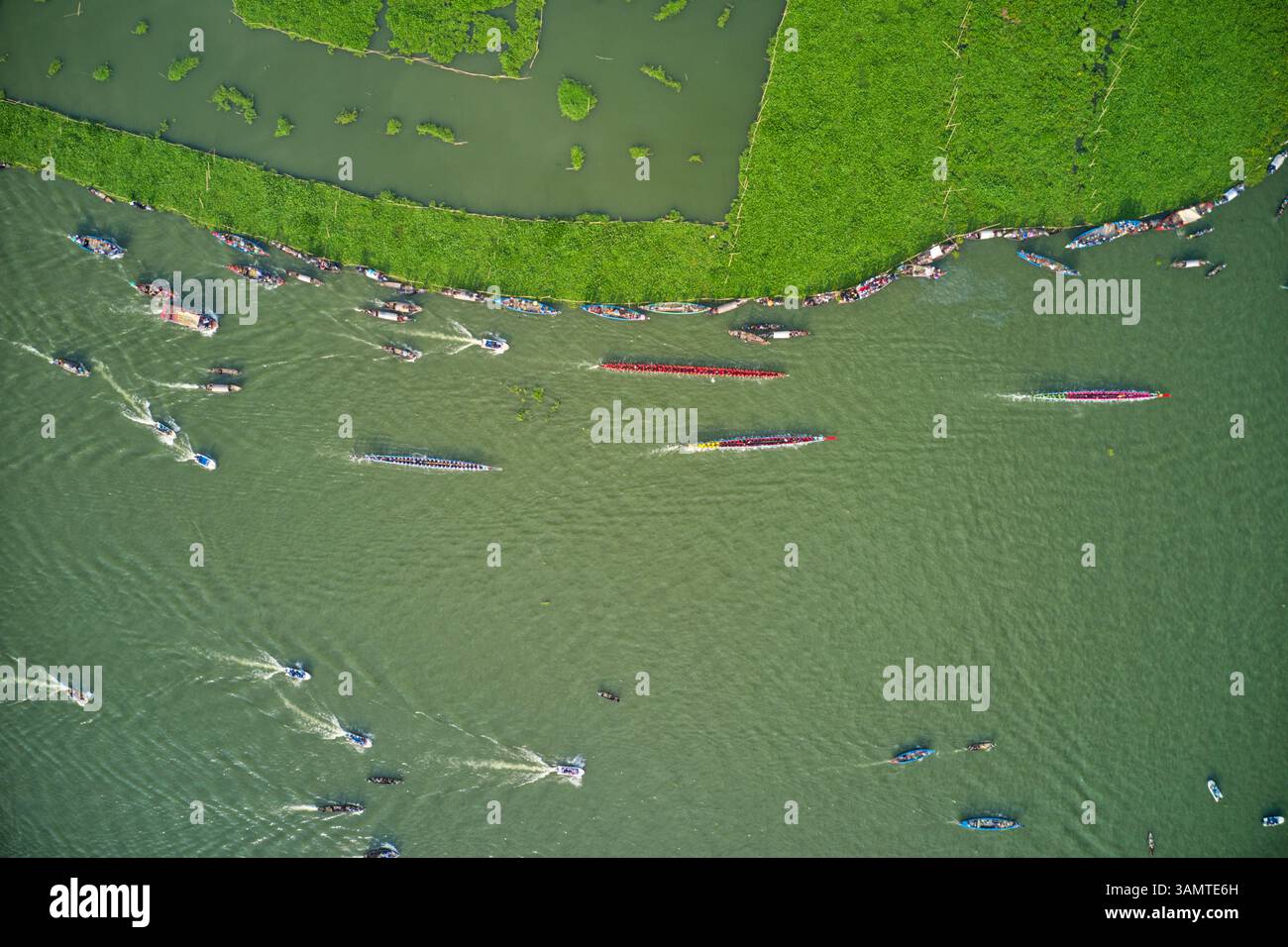 Aerial view of several traditional boats floating in Meghna river branch in Daudkandi ...
