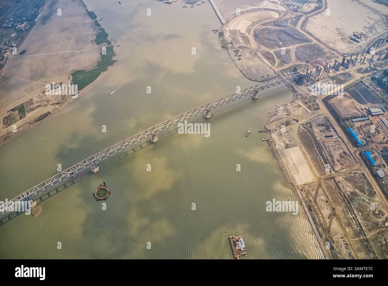 Aerial view of a building site while assembling the Padma bridge, the longest rail and highway ...
