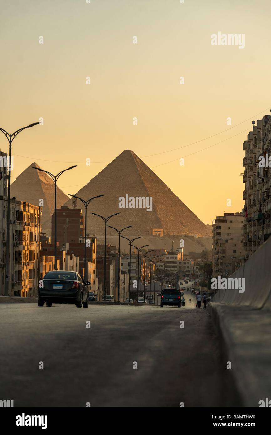 Aerial view of ancient pyramids and urban landscape at sunset with ...
